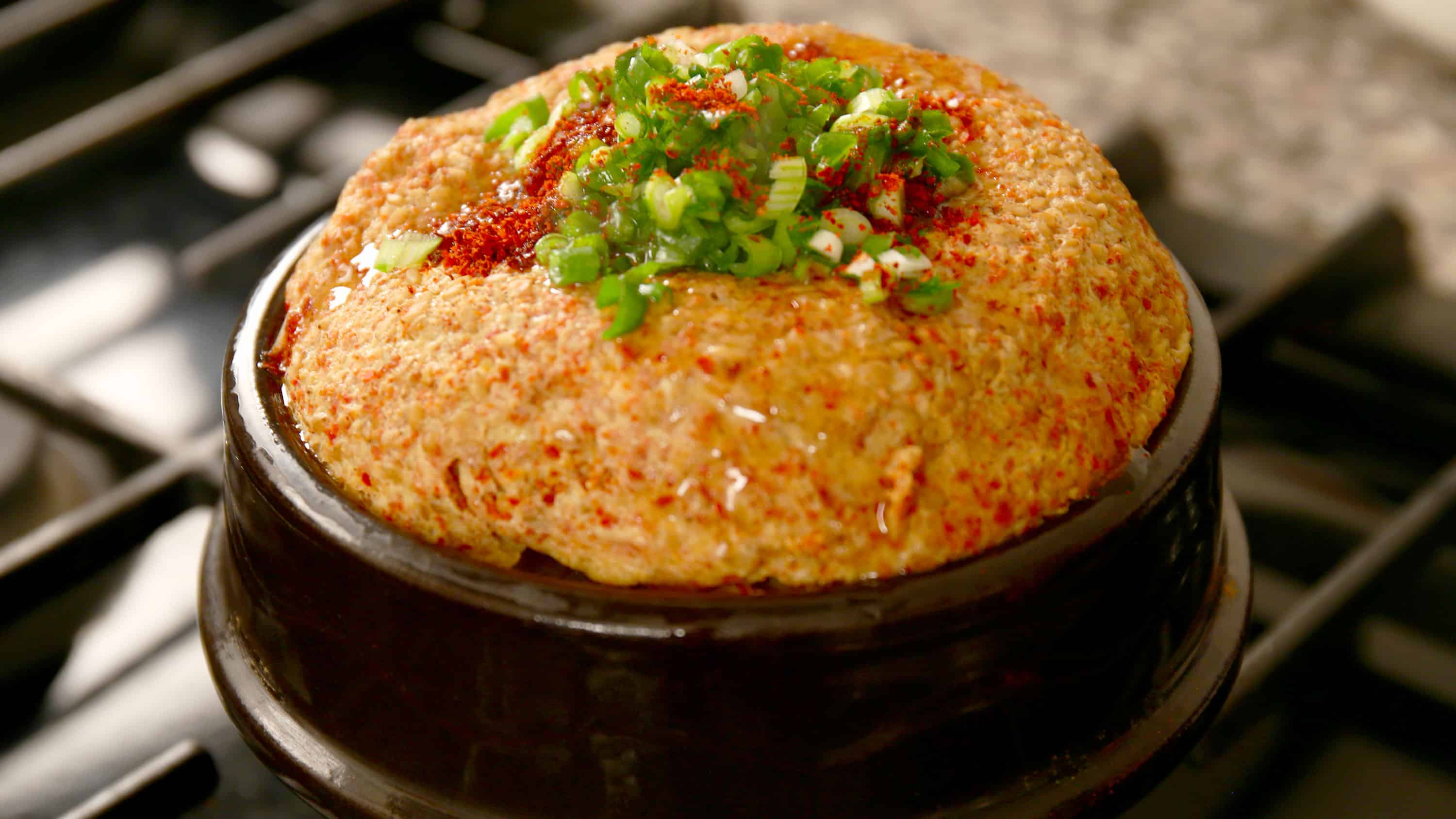 Spicy steamed eggs in an earthenware bowl recipe by Maangchi